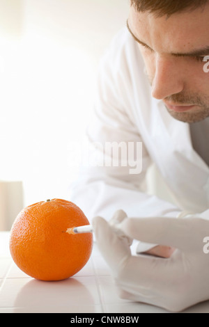 Injecting an Orange Stock Photo - Alamy
