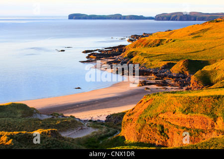 coast in Coldbackie Bay in evening mood, United Kingdom, Scotland ...