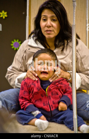 Teachers comfort disoriented vision-impaired children in a sensory ...