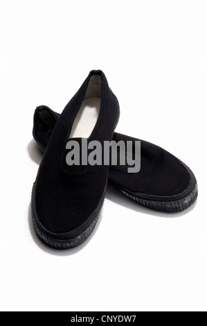 Pair of black slip-on plimsolls or daps Stock Photo: 28103192 - Alamy
