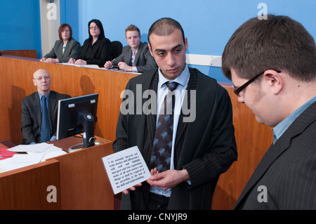 A witness swearing the oath in a magistrates' court Stock Photo - Alamy