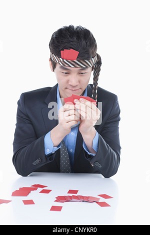 A drunk man gambling at hwatu play Stock Photo - Alamy