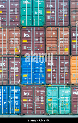 Multi-colored storage crates stacked Stock Photo - Alamy