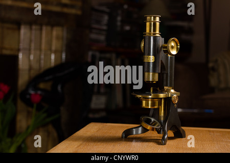 Old fashioned microscope on table Stock Photo - Alamy