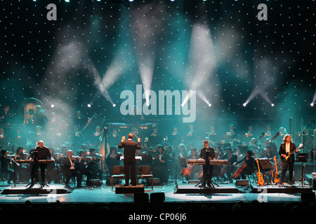 Symphonic orchestra performing on stage and playing a classical music ...