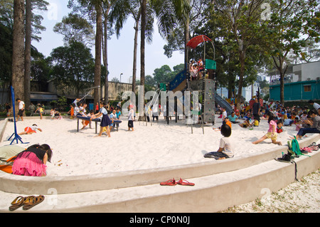 A busy children’s playground / play area with parents and young ...