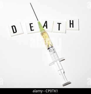medical syringe with text death Stock Photo - Alamy