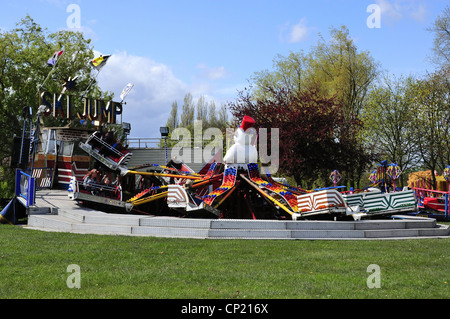 Adults and children on 'Ski Jump' fairground ride having fun Stock ...