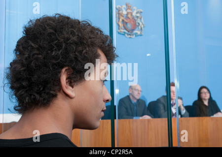 Defendant in the dock in a magistrates court Stock Photo - Alamy
