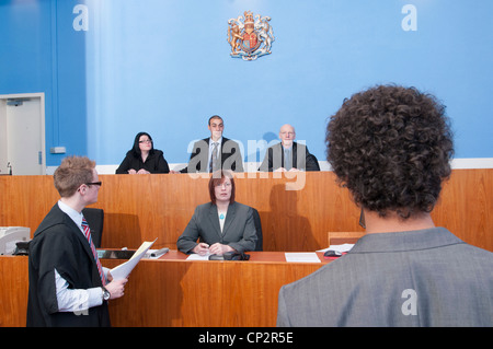 Defendant in the dock in a magistrates court Stock Photo - Alamy