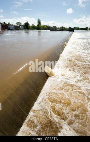 The River Exe overflowing into Exeter's flood relief and breaking the ...