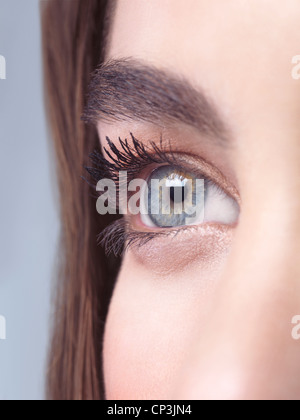 Close-up shot of beautiful young woman using her mobile phone and text ...