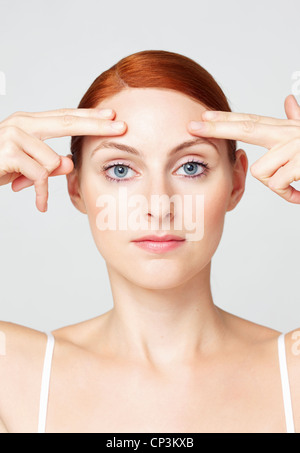 Eyebrow massage. Beautiful caucasian young white woman receiving an eye ...