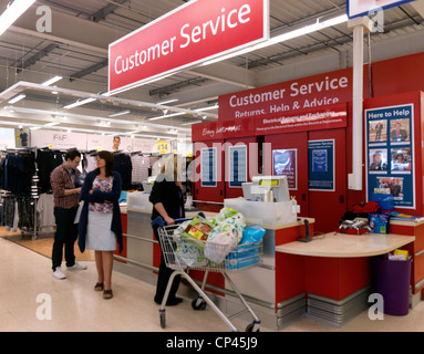 Customer At Customer Service Desk Tescos Supermarket Surrey England ...