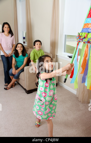 Children Hitting Pinata At Birthday Party Stock Photo - Alamy