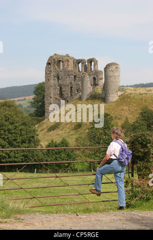 Clun Castle and walker at gate Clun Shropshire England UK Stock Photo ...