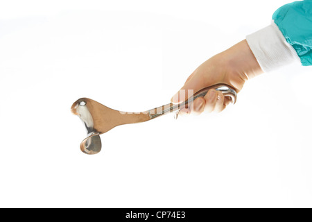 Surgical instrument held by surgeons hand Stock Photo - Alamy