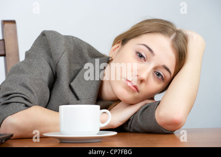 Portrait of a beautiful woman looking tired and stressed, isolated on ...