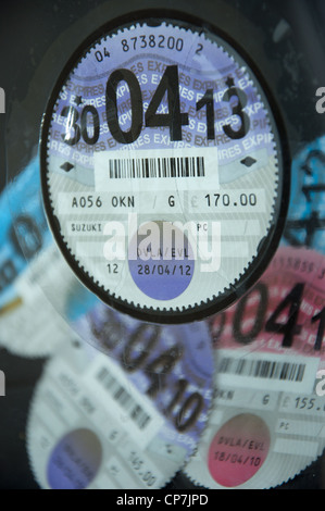 Tax disc in car windscreen Stock Photo - Alamy