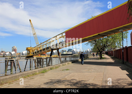 Thames Path and cycle route at Woolwich with distant views of Canary ...
