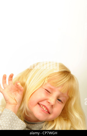 Girl child portrait with cheeky look in striped sweater isolated on ...