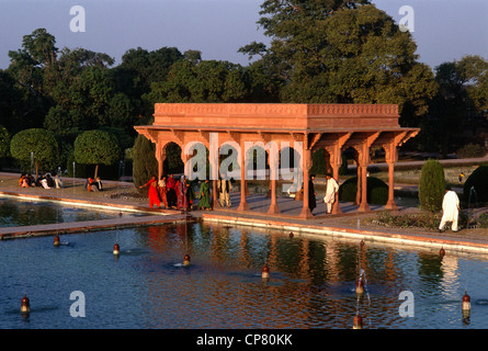 Pakistan Punjab Lahore Shalimar Gardens visitors walking across lake on ...
