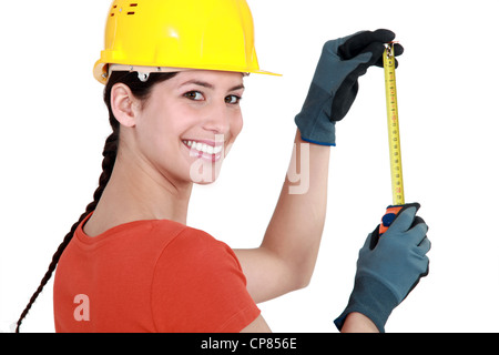 Young woman laborer holding her head Stock Photo - Alamy