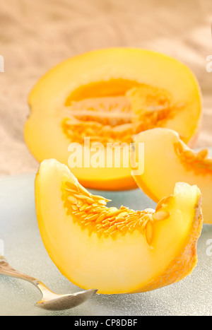 Melon half and slices isolated on white background with full depth of ...