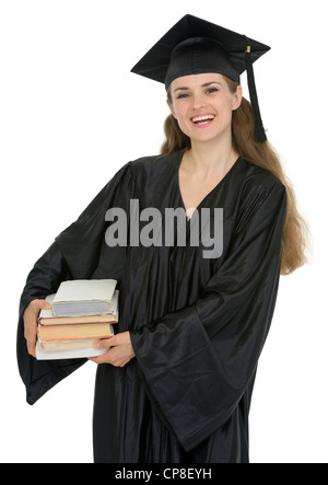 A girl holding books and graduation cap Stock Photo - Alamy