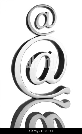 At symbol paperweight on a reflective surface Stock Photo - Alamy