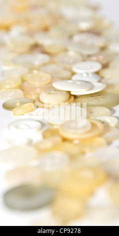 light color sewing buttons Stock Photo - Alamy