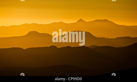 Death Valley stunning sunrise colors in sediment layers of mountains ...