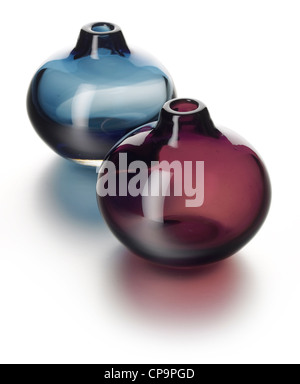 Bottles of perfume with flowers on purple background Stock Photo - Alamy