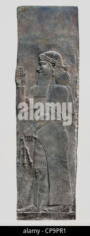 Figure holding a poppy flower Neo Assyrian palace of Sargon II 721-705 ...