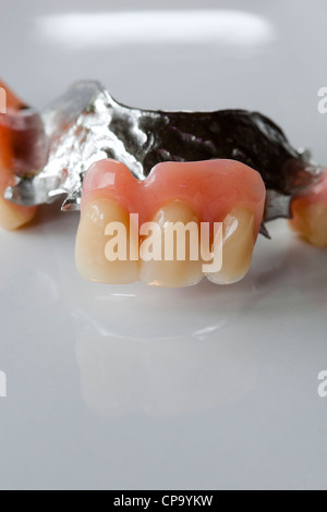 Dentist cleaning teeth with titanium metal tooth pick instrument to ...