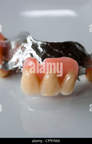 Dentist cleaning teeth with titanium metal tooth pick instrument to ...