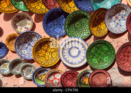 Traditional Moroccan handmade plates hanging on a wall Stock Photo - Alamy