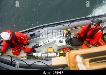 A Canadian Coast Guard Rigid Hull Inflatable Boat (RIB) and crew on ...