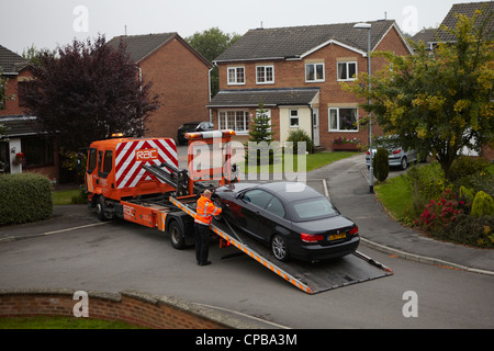 RAC recovery vehicle towing away a broken down car, a BMW Stock Photo ...