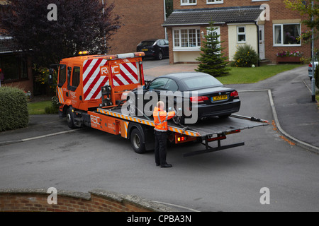 RAC recovery vehicle towing away a broken down car, a BMW Stock Photo ...