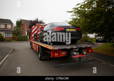 RAC recovery vehicle towing away a broken down car, a BMW Stock Photo ...