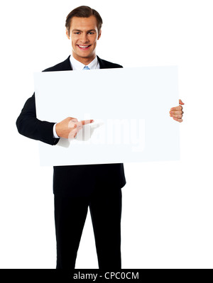 Businessman and pointing banner Stock Photo - Alamy