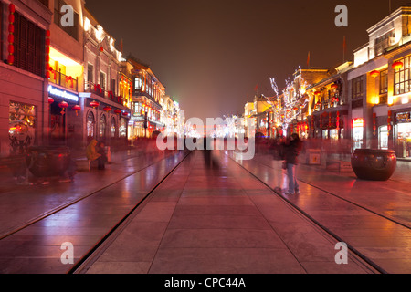 People shop at a store at Qianmen Street in Beijing, Sunday, July 20 ...