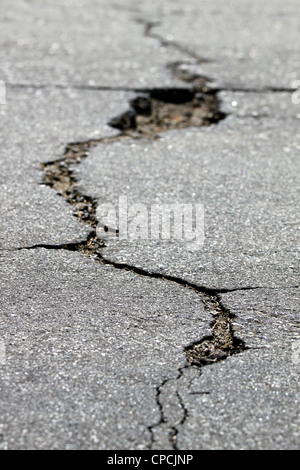 Detail of crack and break in a road Stock Photo - Alamy
