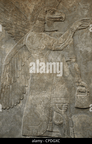 Assyrian wall relief of a winged genius. Ancient carving panel from the ...