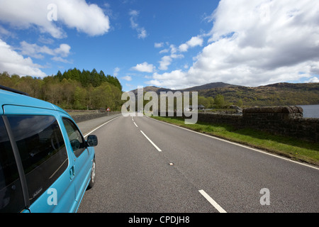 car driving along the a82 past west loch lomond on the old military ...
