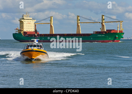 Waterjet powered pilot boat "Gemini" heading to a cargo ship ...