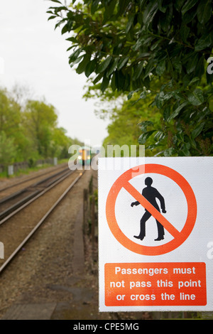 Passengers must not pass this point or cross the line warning sign ...