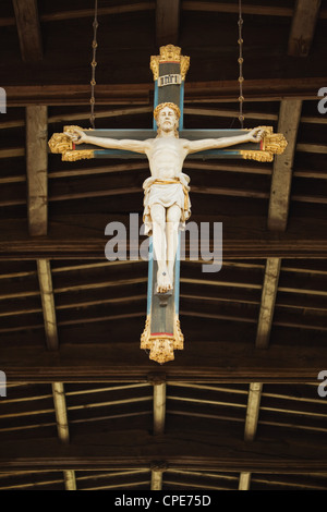Statue of Jesus hanging on the cross with shadow on the walls of Santo ...