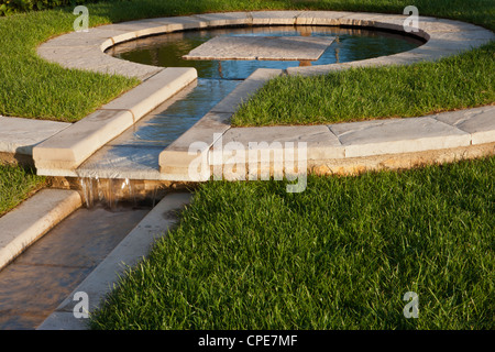 a garden with garden rill water feature made from copper water marginal ...